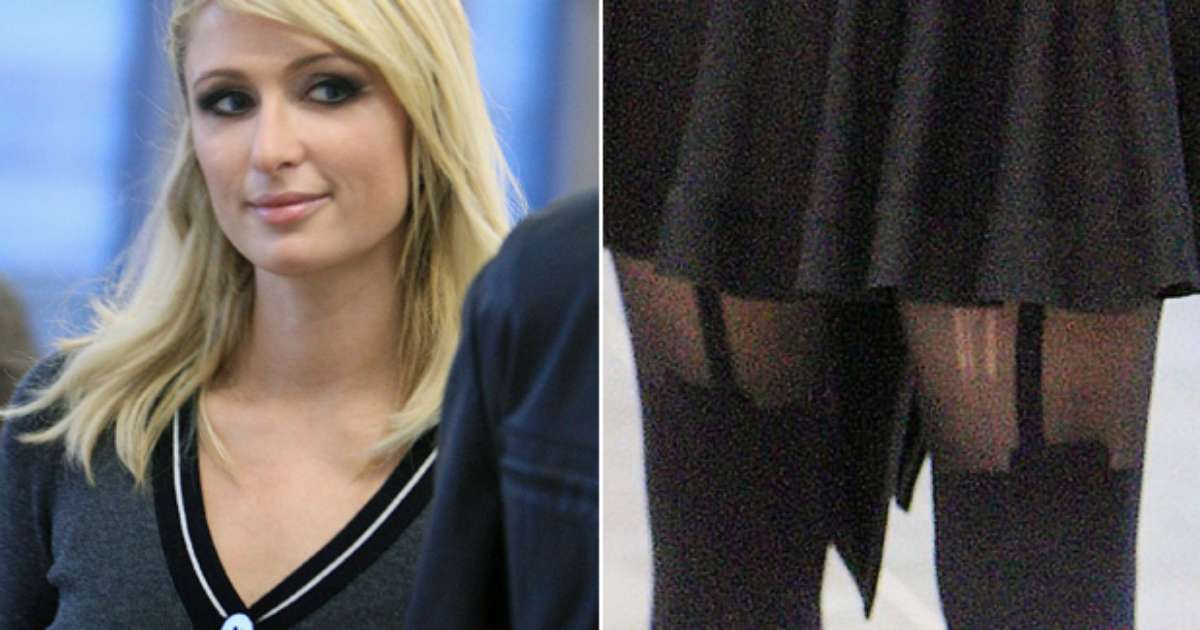 De meia-calça rasgada, Paris Hilton prestigia namorado em desfile
